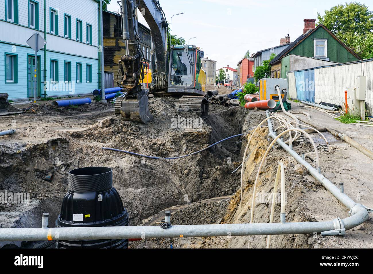 Street reconstruction view, deep trench, dewatering system, new and old ...