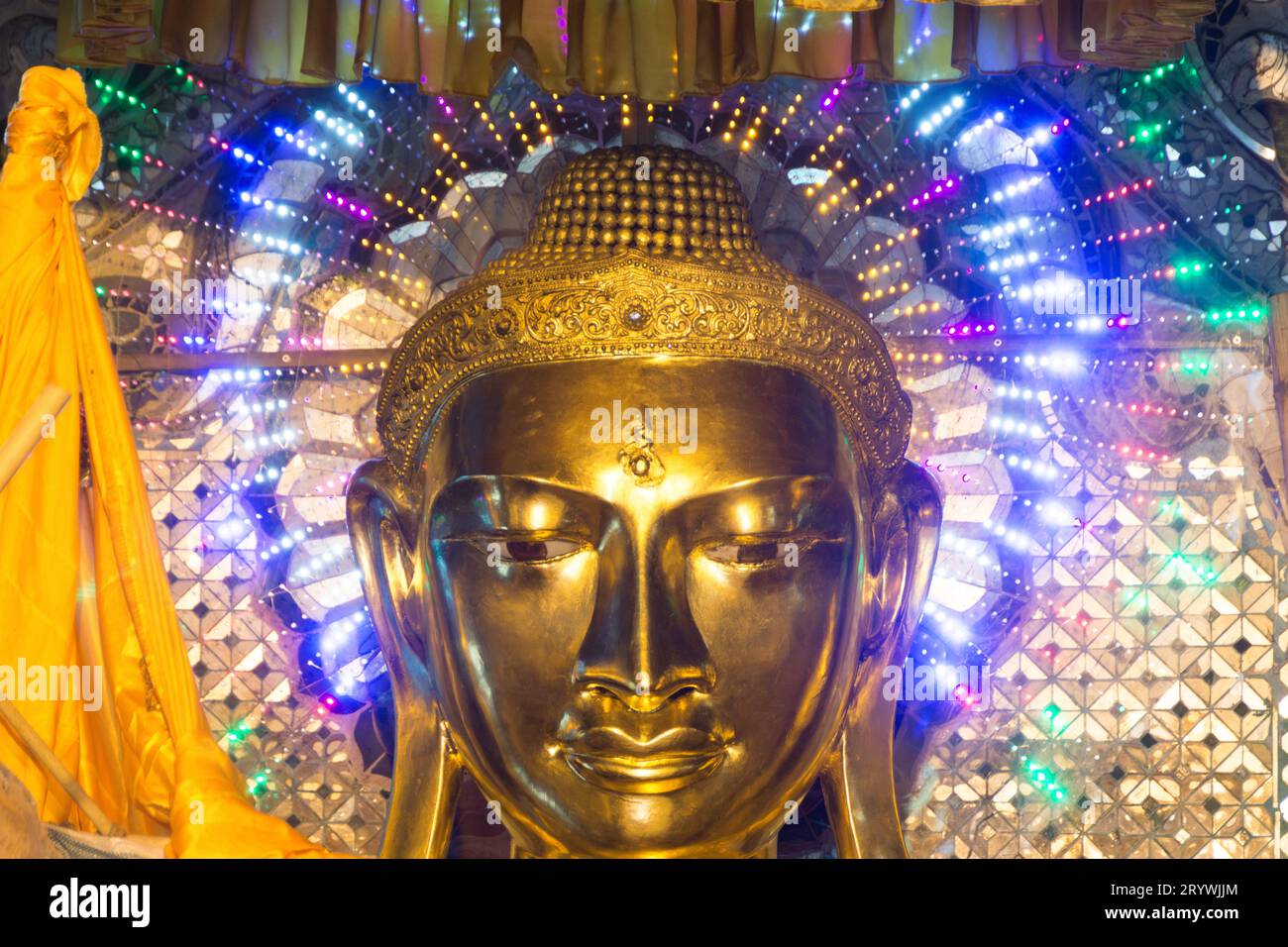 BUDDHA STATUE with modern electric halo at the SHWEDAGON PAYA or PAGODA ...