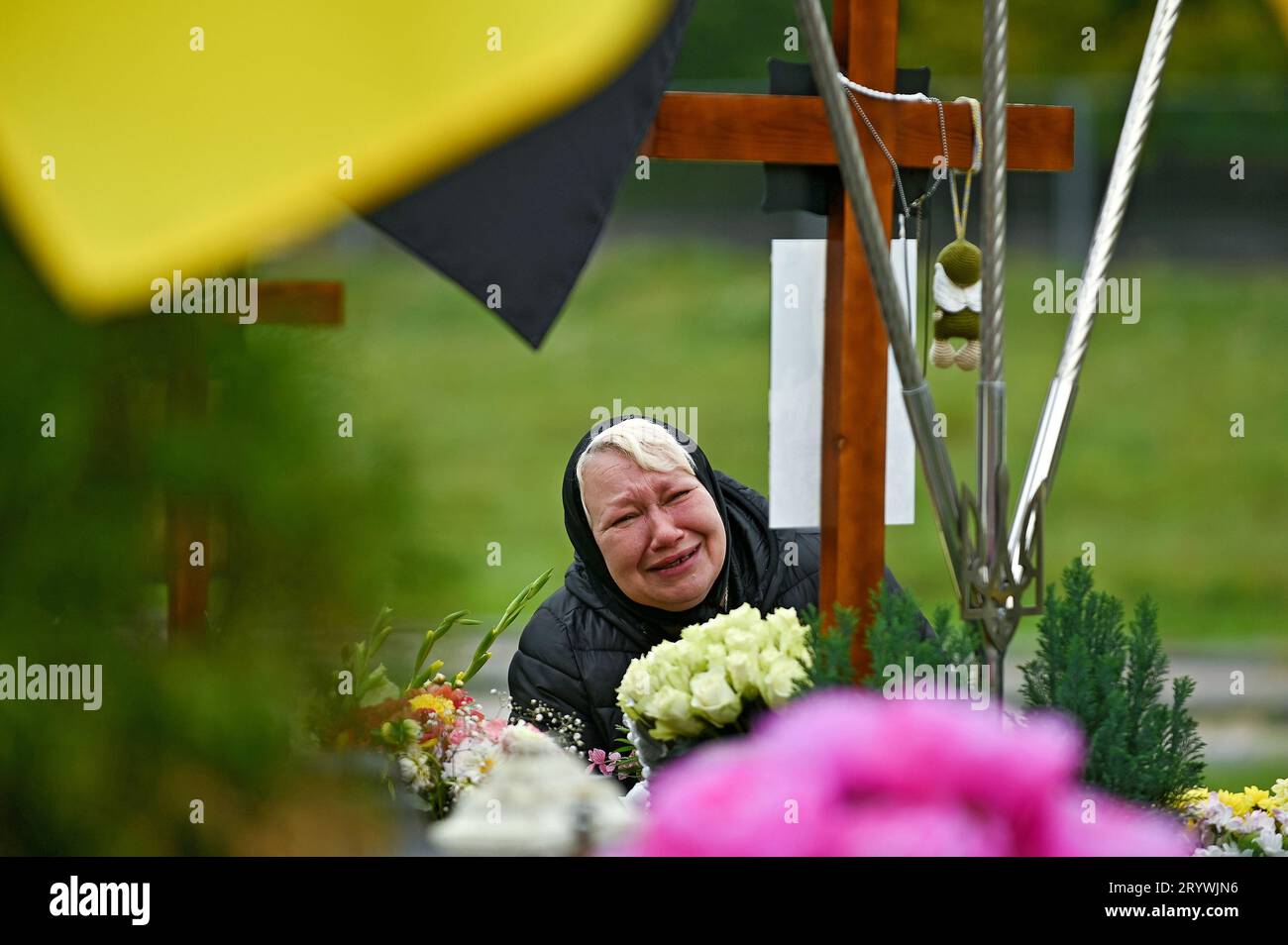 Non Exclusive: LVIV, UKRAINE - OCTOBER 01 - A woman cries at the grave ...