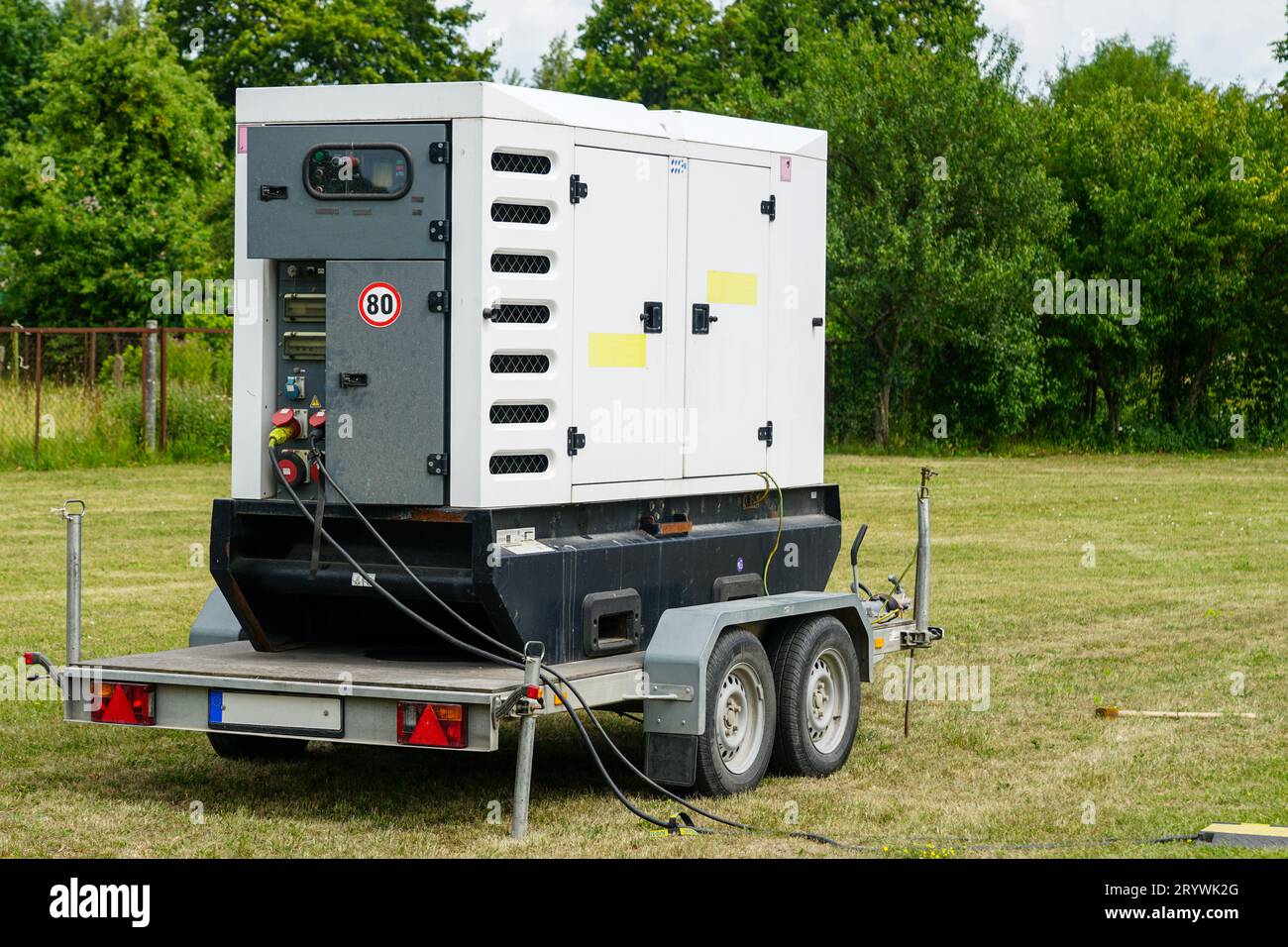 Connected large rental diesel generator on a mobile trailer for outdoor ...