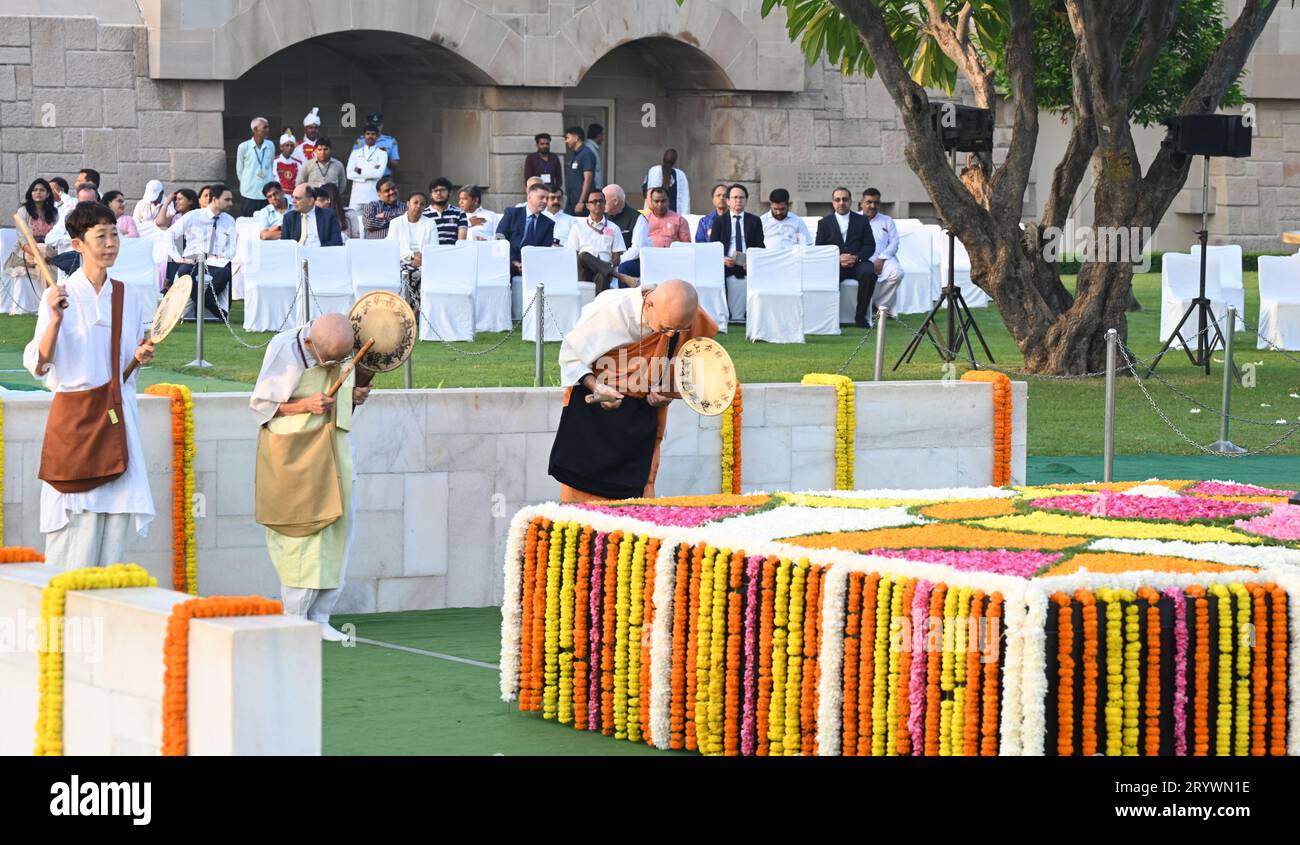 NEW DELHI, INDIA - OCTOBER 2: Buddhist monk paying tribute to Mahatma ...
