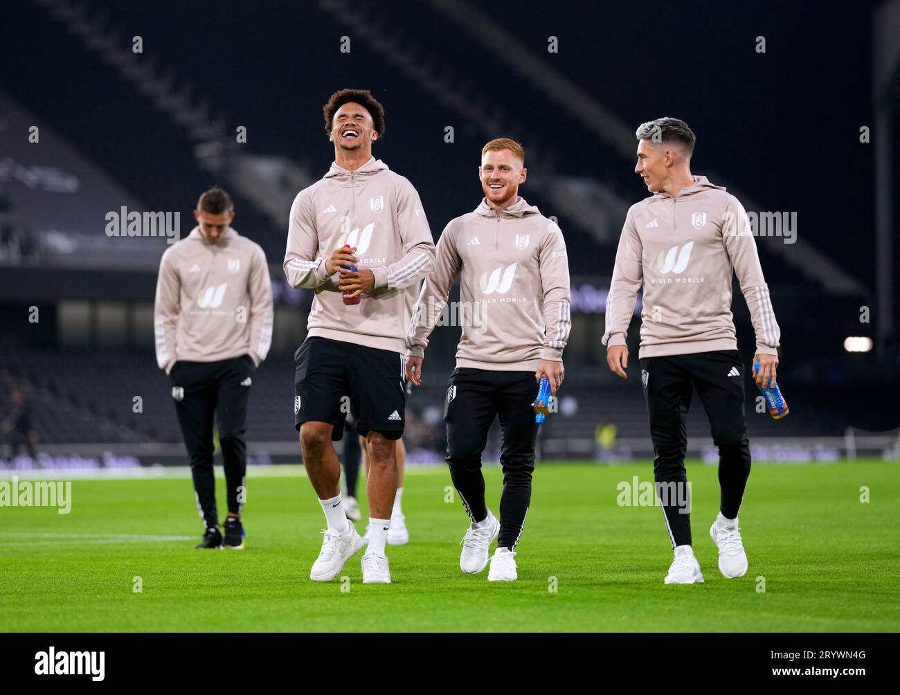Fulham's Antonee Robinson (left), Harrison Reed and Harry Wilson walk ...