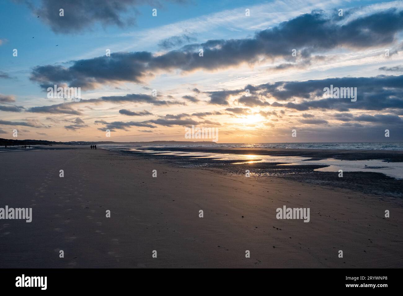 Dramatic Sunset Sky Reflected in the Beach and Sea Waves Stock Photo ...