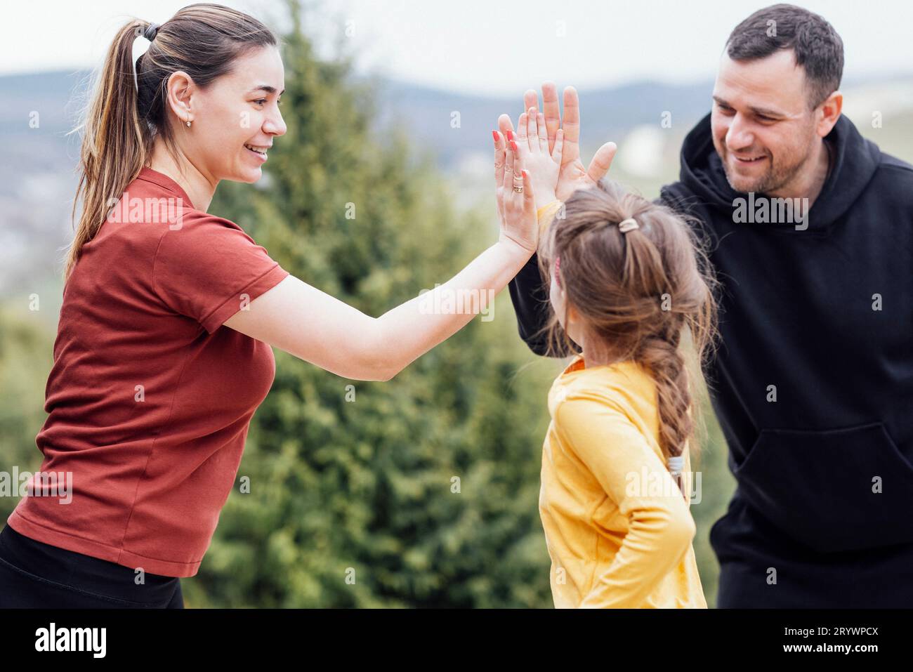 Parents high five child hi-res stock photography and images - Alamy