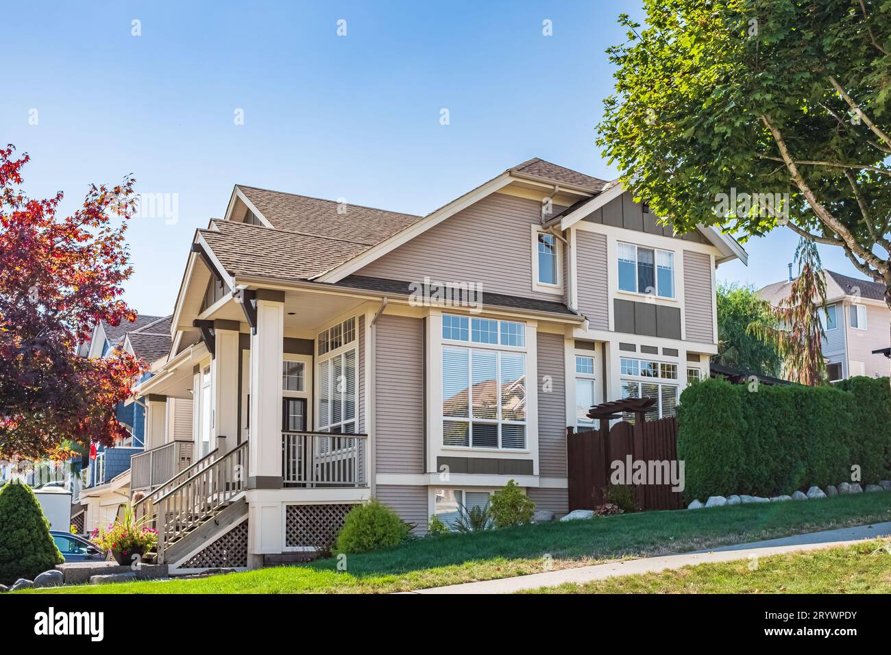 Real Estate Exterior Front House on a sunny day. Big custom made luxury ...