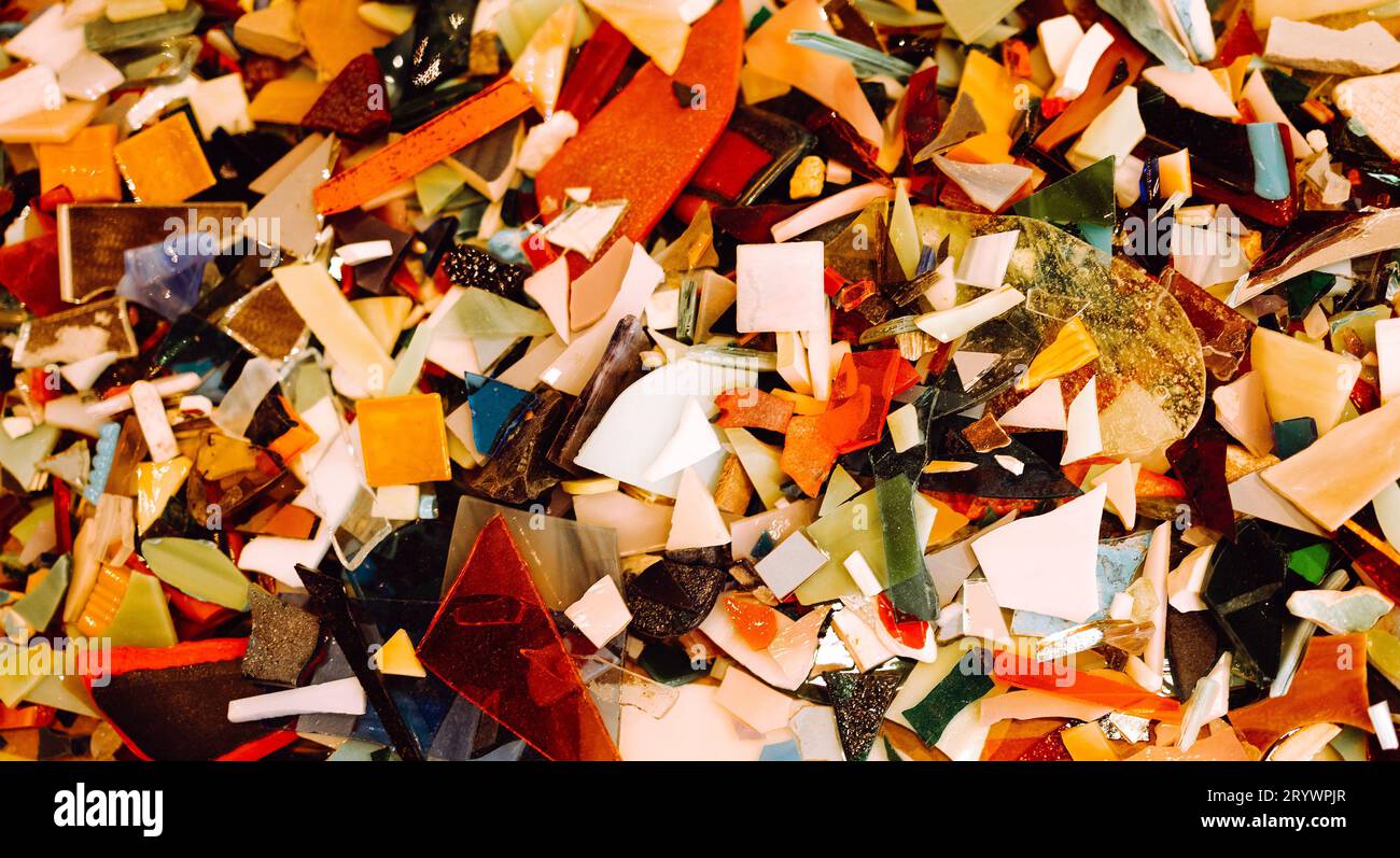Bright background from many pieces of glass and ceramics of different ...