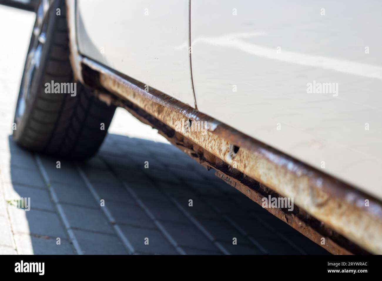 Rotten sills of an old gray car close up Stock Photo - Alamy