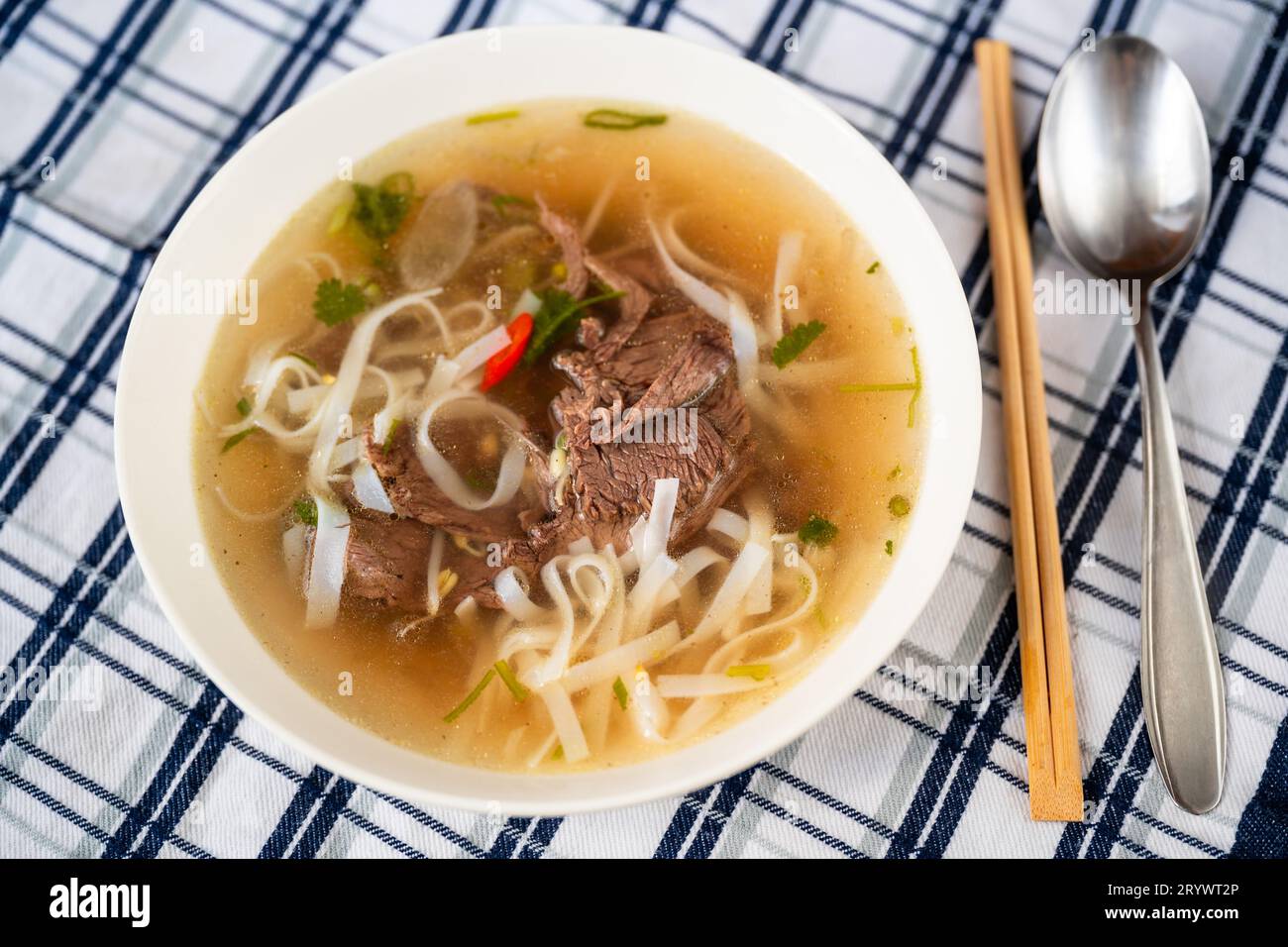 Traditional vietnamese spicy soup Pho Bo with beef piece, rice noodle ...