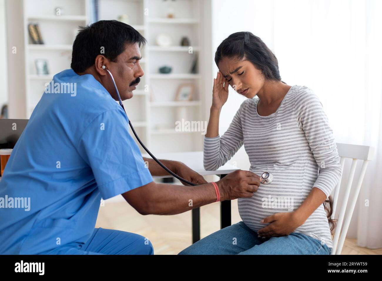 Prenatal Care. Obstetrician Doctor Doing Checkup To Sick Pregnant Woman ...