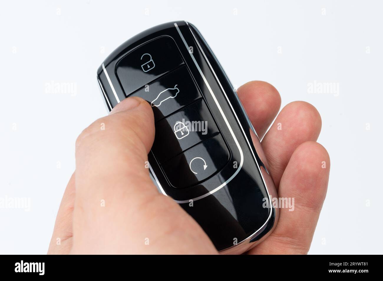 Open car trunk with key button on hand isolated close up view Stock ...