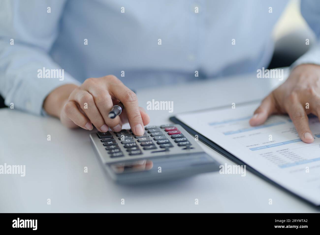 Businesswoman Accountant analyzing investment charts Invoice and ...