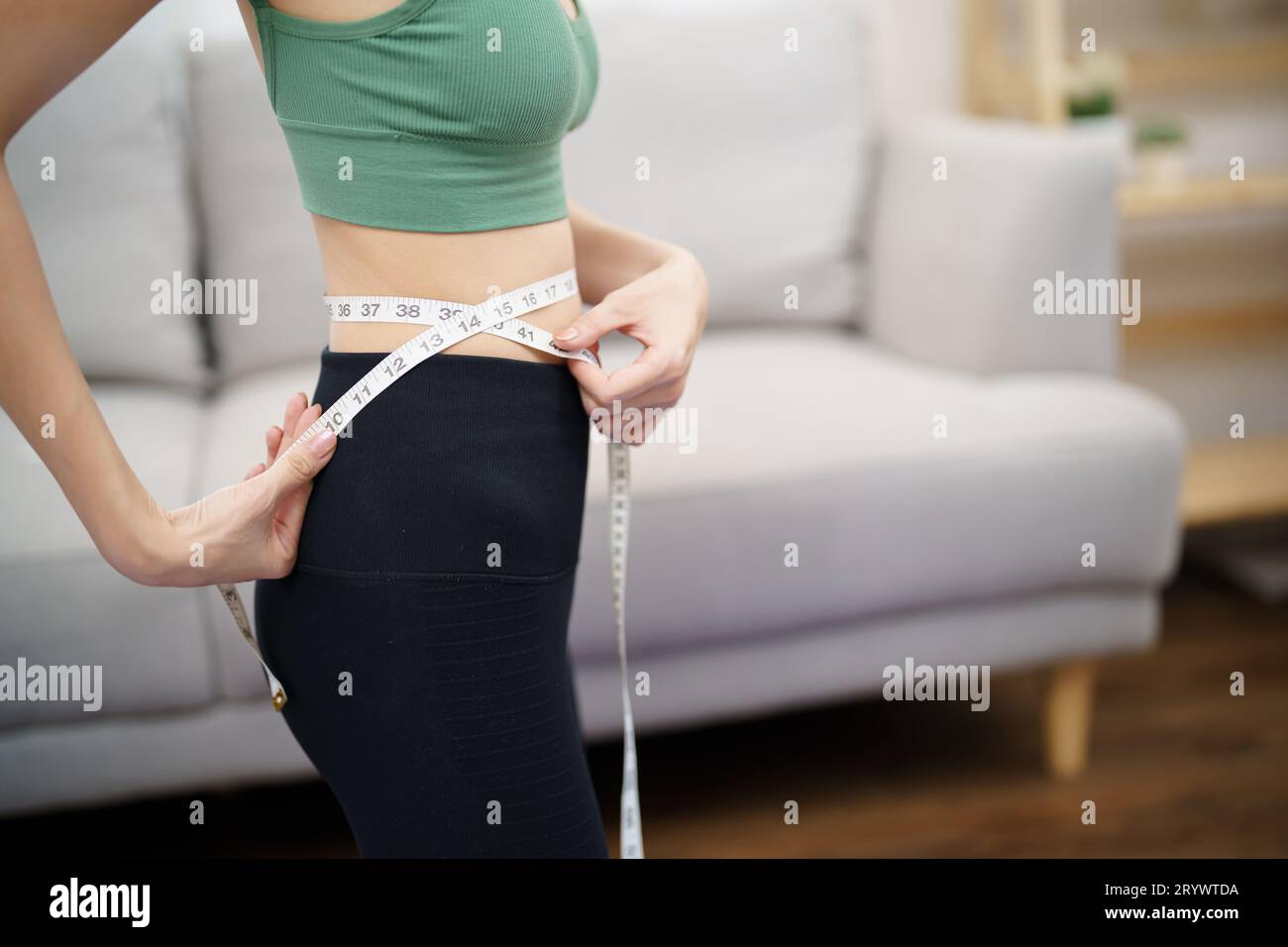 Asian girl woman measuring waist hi-res stock photography and images ...
