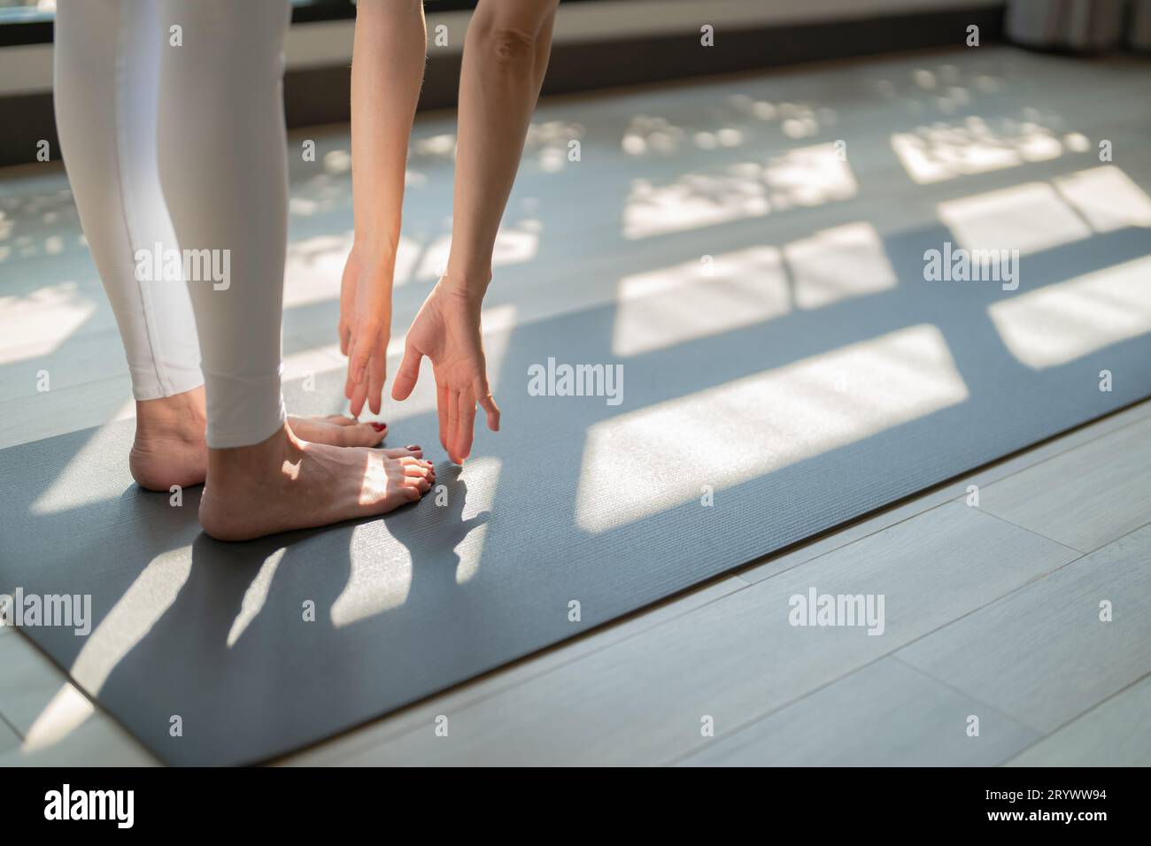 Flexible sport asian woman warming upÂ Fitness woman doing stretch ...