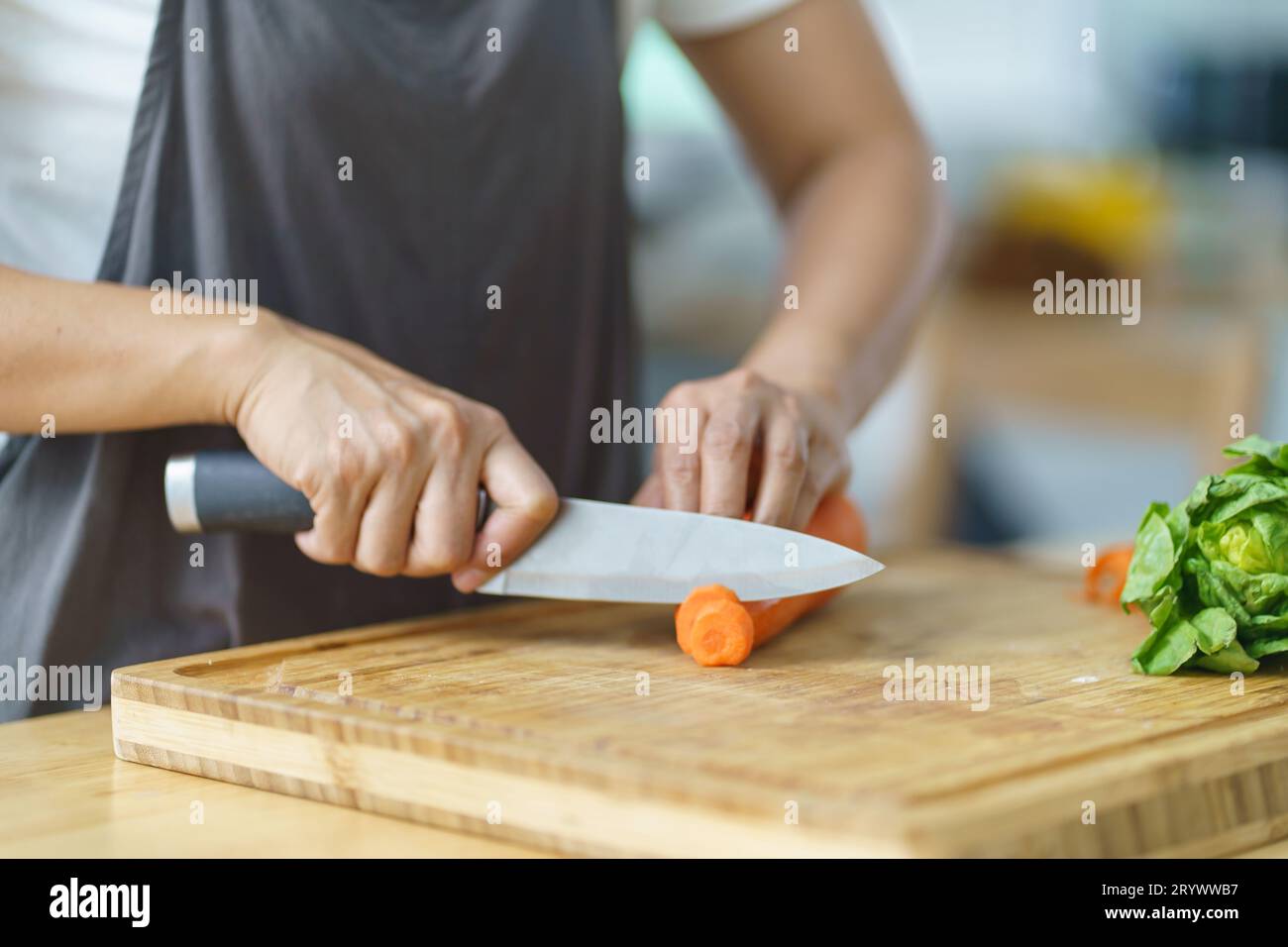Prepare food Â woman is preparing vegetable salad in the kitchen ...