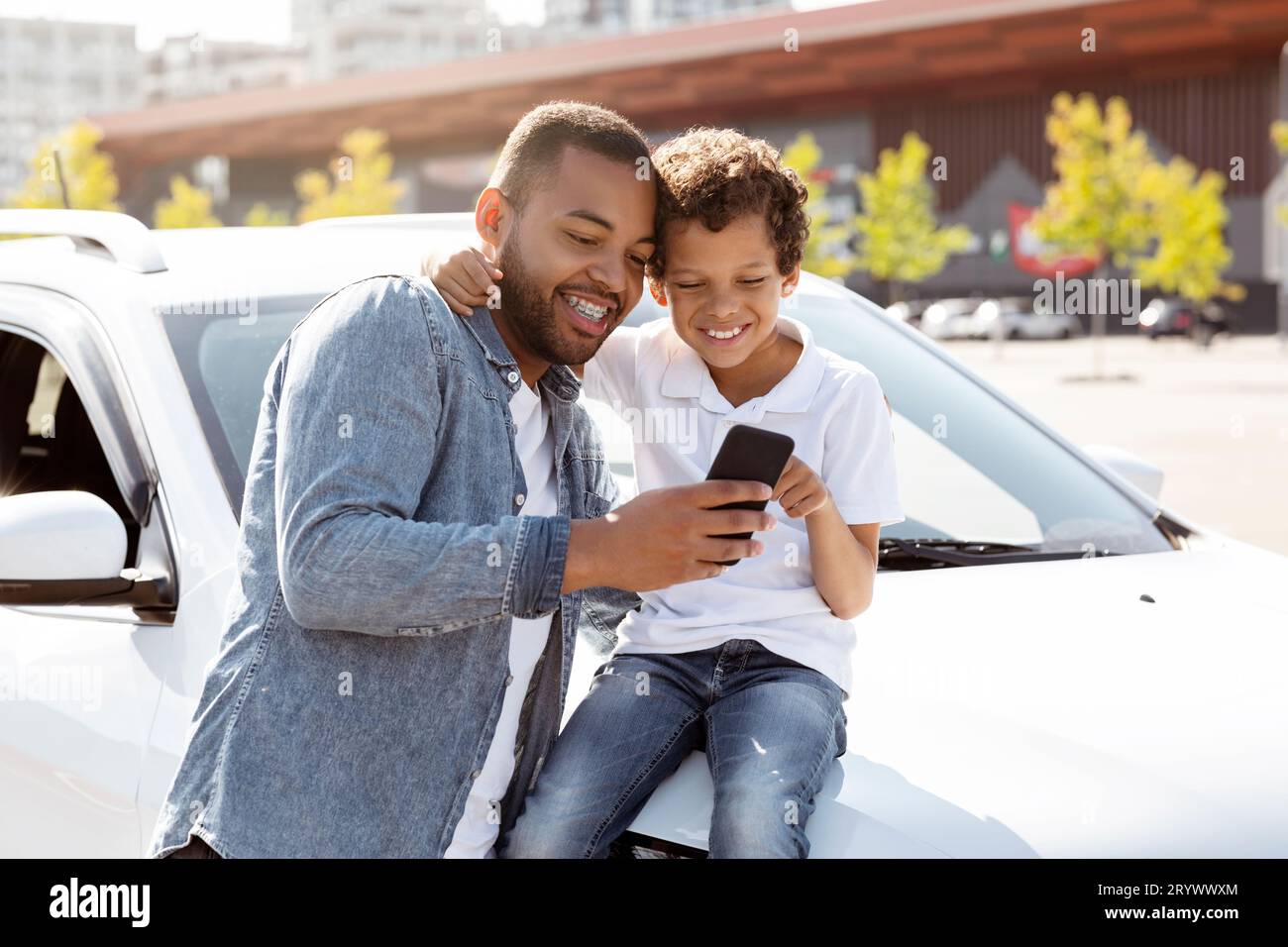 Exciting african american father son going car ride, choosing ...