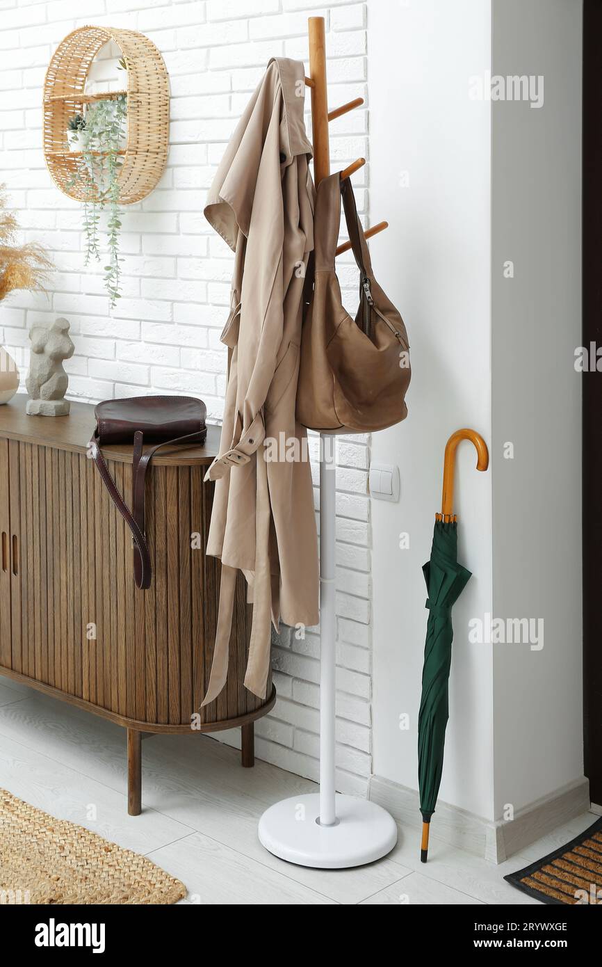 Interior of light hall with shelf, drawers and rack Stock Photo - Alamy