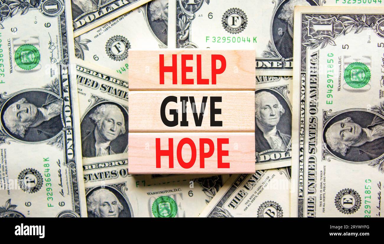 Help give hope symbol. Concept word Help give hope on beautiful wooden ...