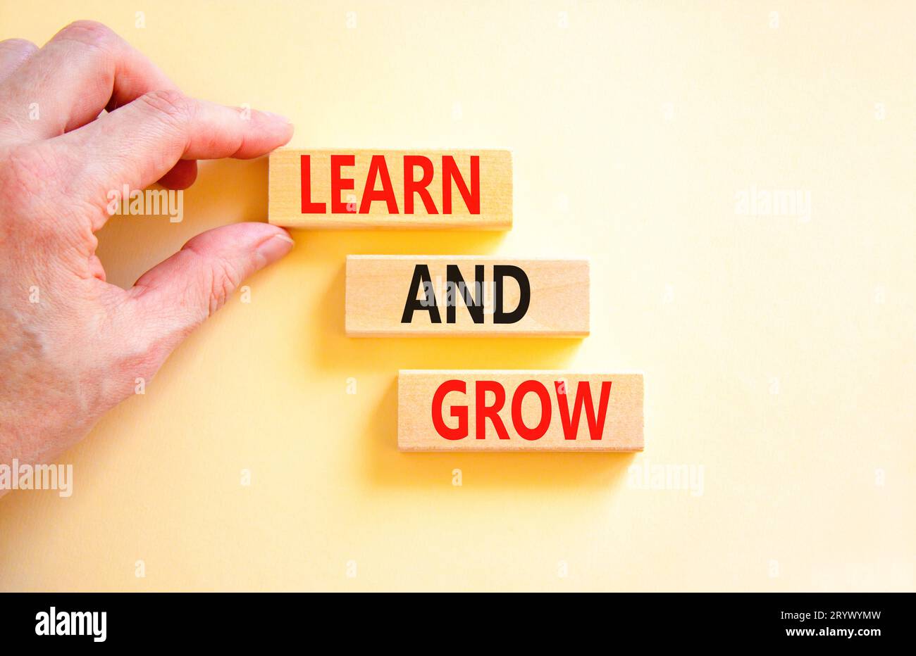 Learn and grow symbol. Concept word Learn And Grow on beautiful wooden ...