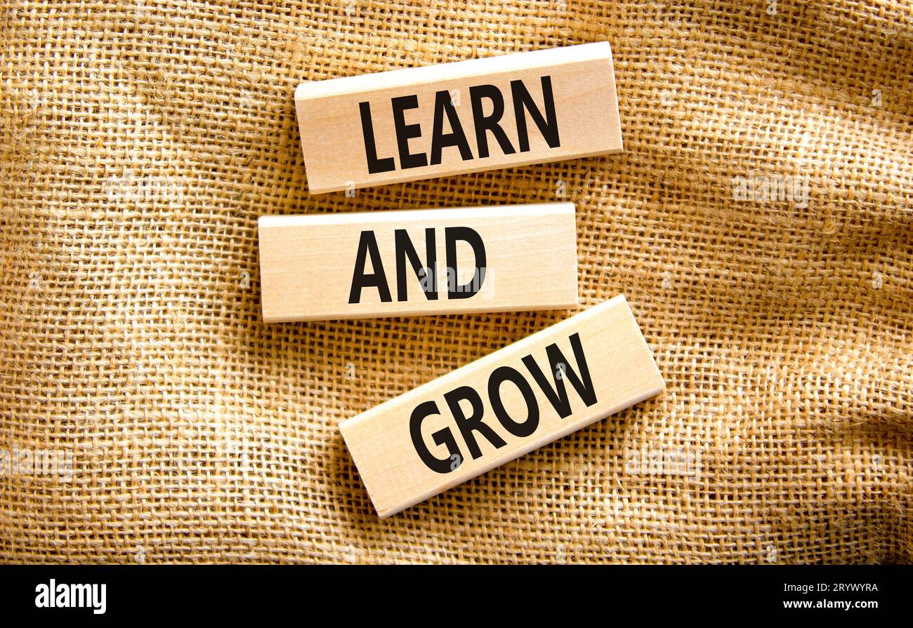 Learn and grow symbol. Concept word Learn And Grow on beautiful wooden ...