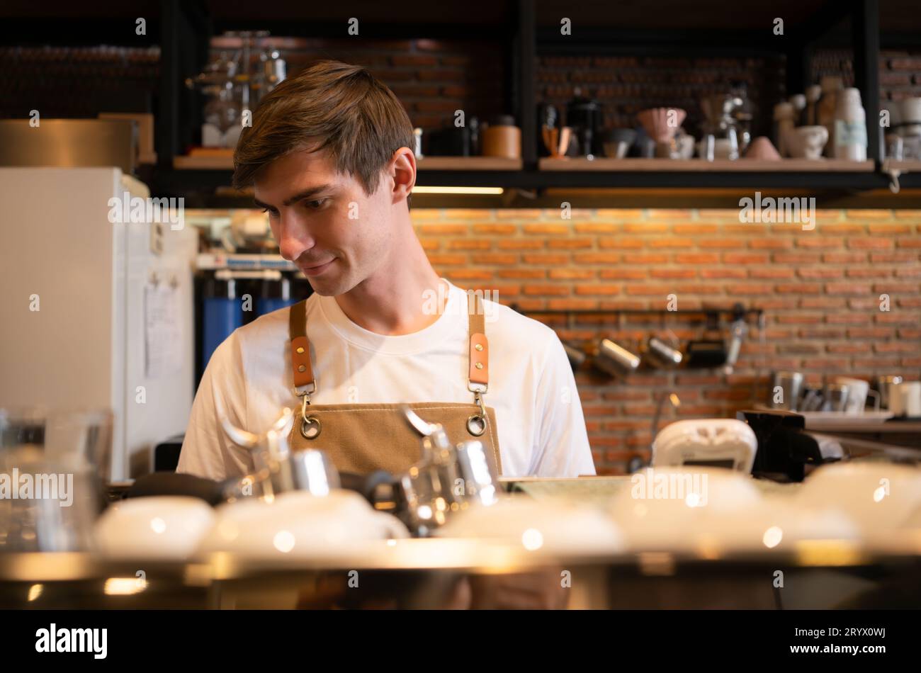 Caucasian male barista apron preparing hi-res stock photography and ...