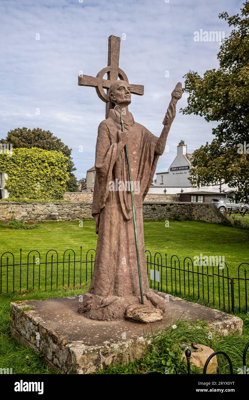 Statue of Saint Aidan in the grounds of Lindisfane Priory on Holy Island, Northumberland, UK on ...