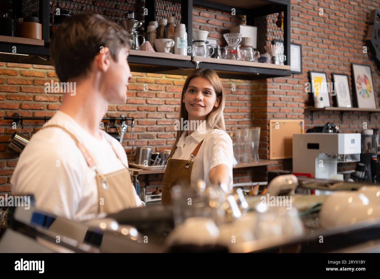 Barista behind counter coffee shop hi-res stock photography and images ...