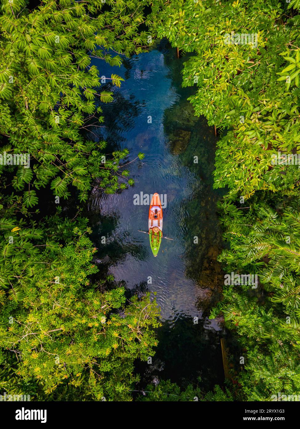 Couple in kayak in the jungle of Krabi Thailand, men and woman in kayak ...