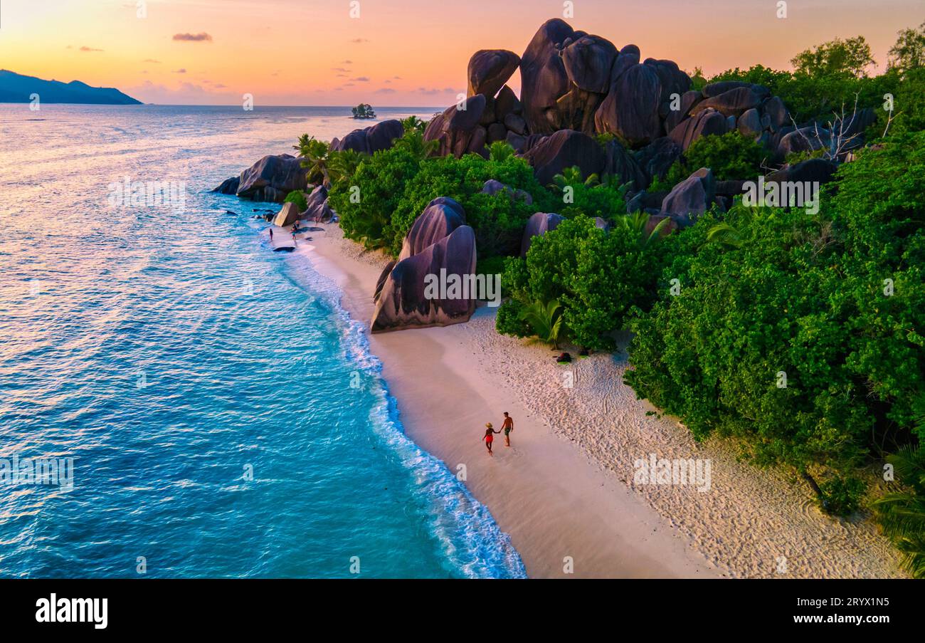 Anse Source d'Argent, La Digue Seychelles, young couple men and woman ...