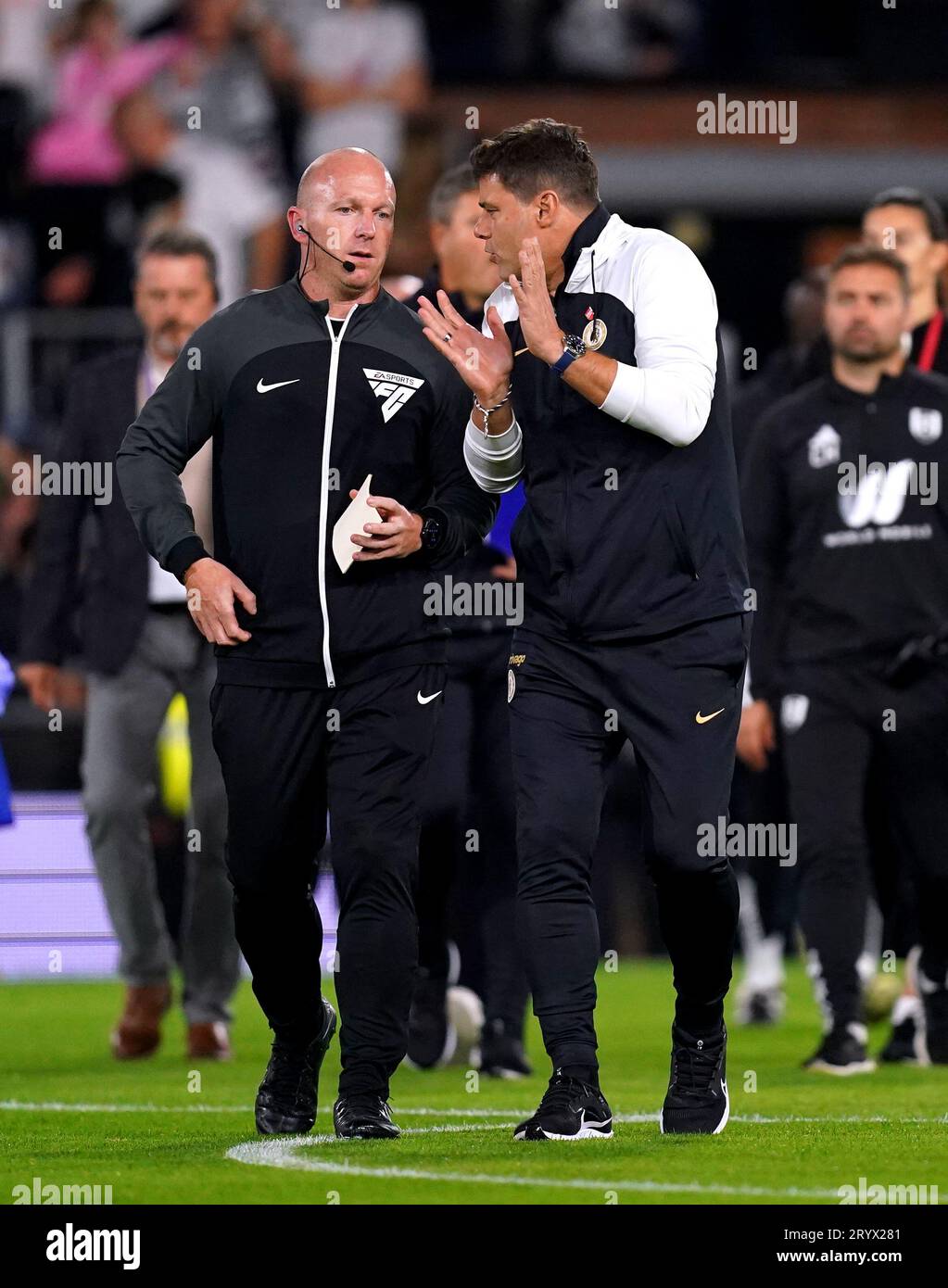 Chelsea manager Mauricio Pochettino (right) speaks to fourth official ...