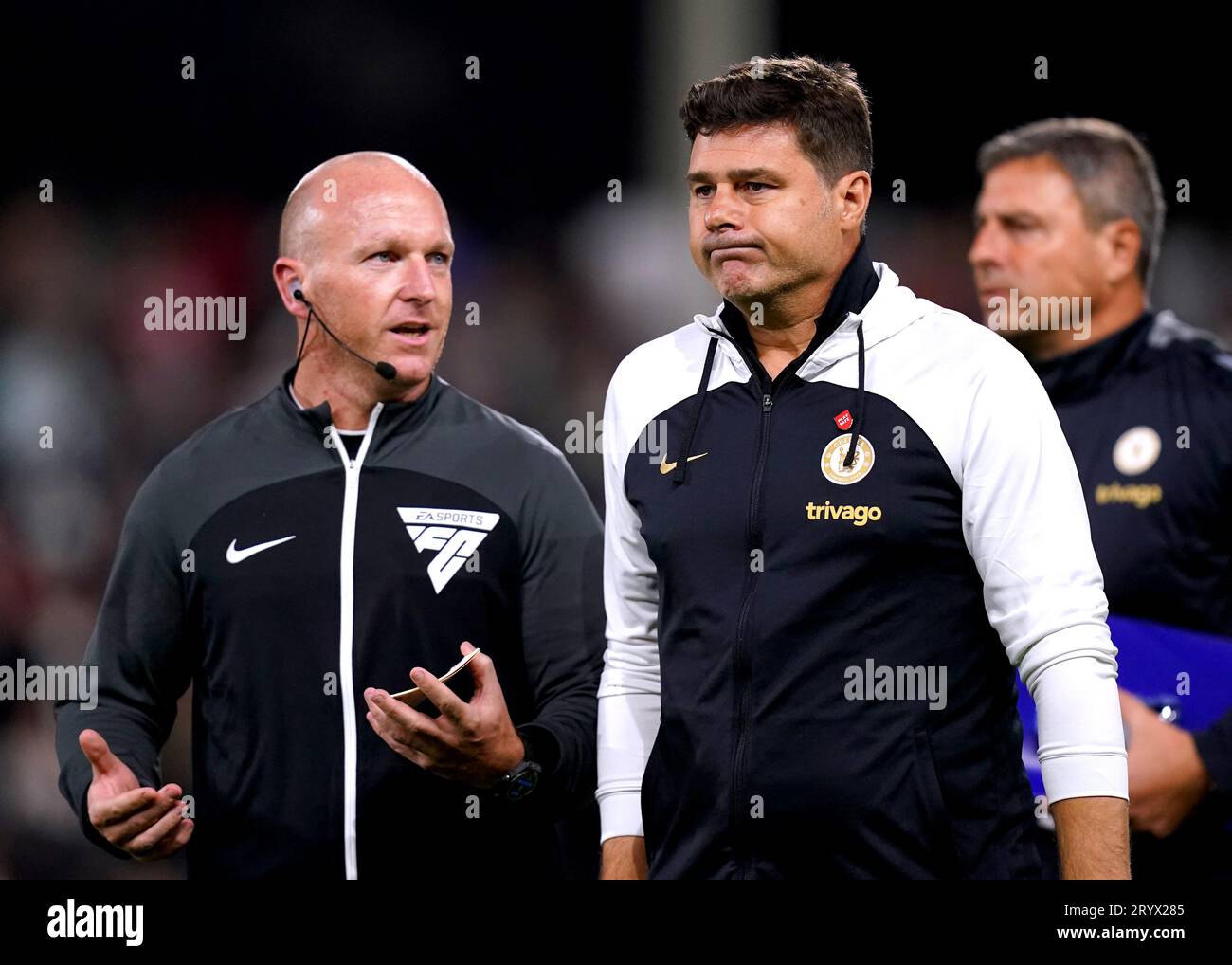 Chelsea manager Mauricio Pochettino (right) speaks to fourth official ...