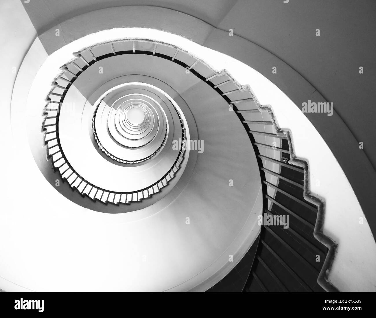 Spiral staircase seen in perspective with the steps going towards ...