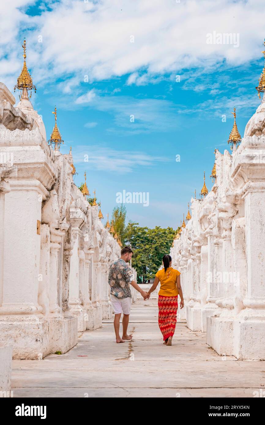Kuthodaw pagoda in Mandalay, Burma Myanmar, happy young couple men and ...