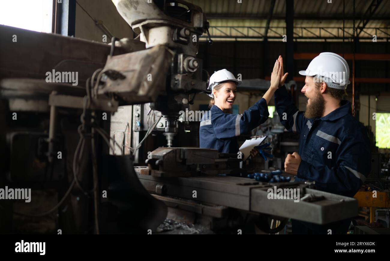 Both of mechanical engineers are checking the working condition of an ...