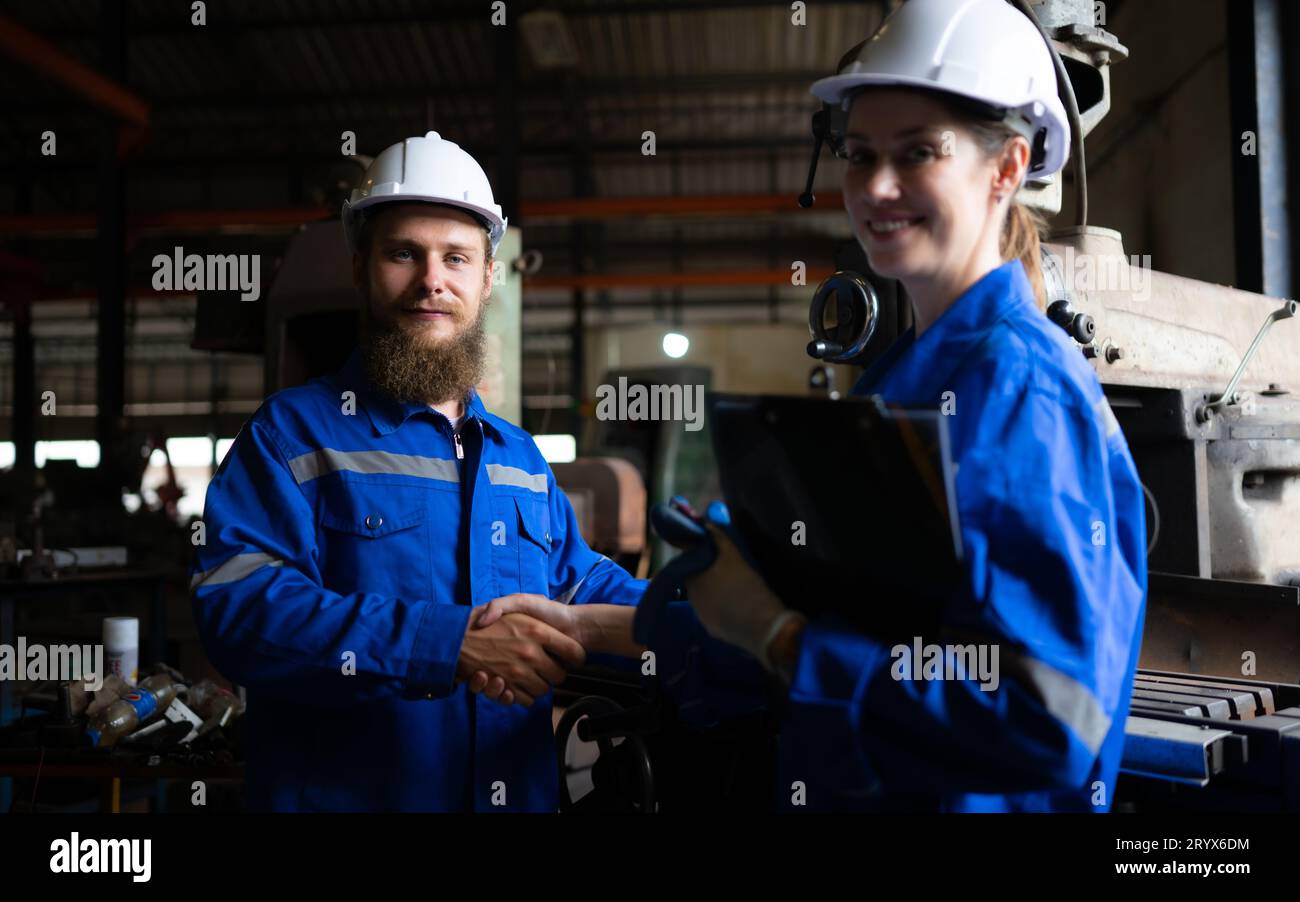 Both of mechanical engineers are checking the working condition of an ...