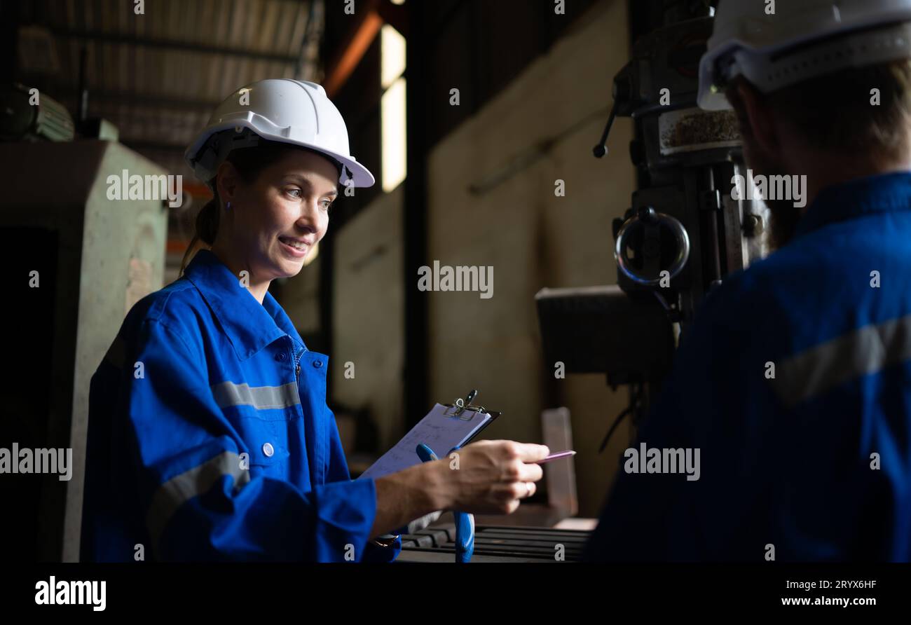 Both of mechanical engineers are checking the working condition of an ...