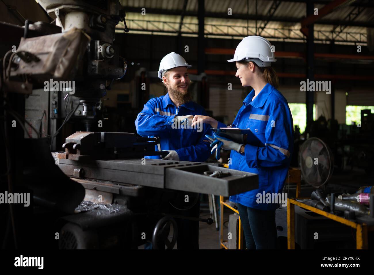 Both of mechanical engineers are checking the working condition of an ...