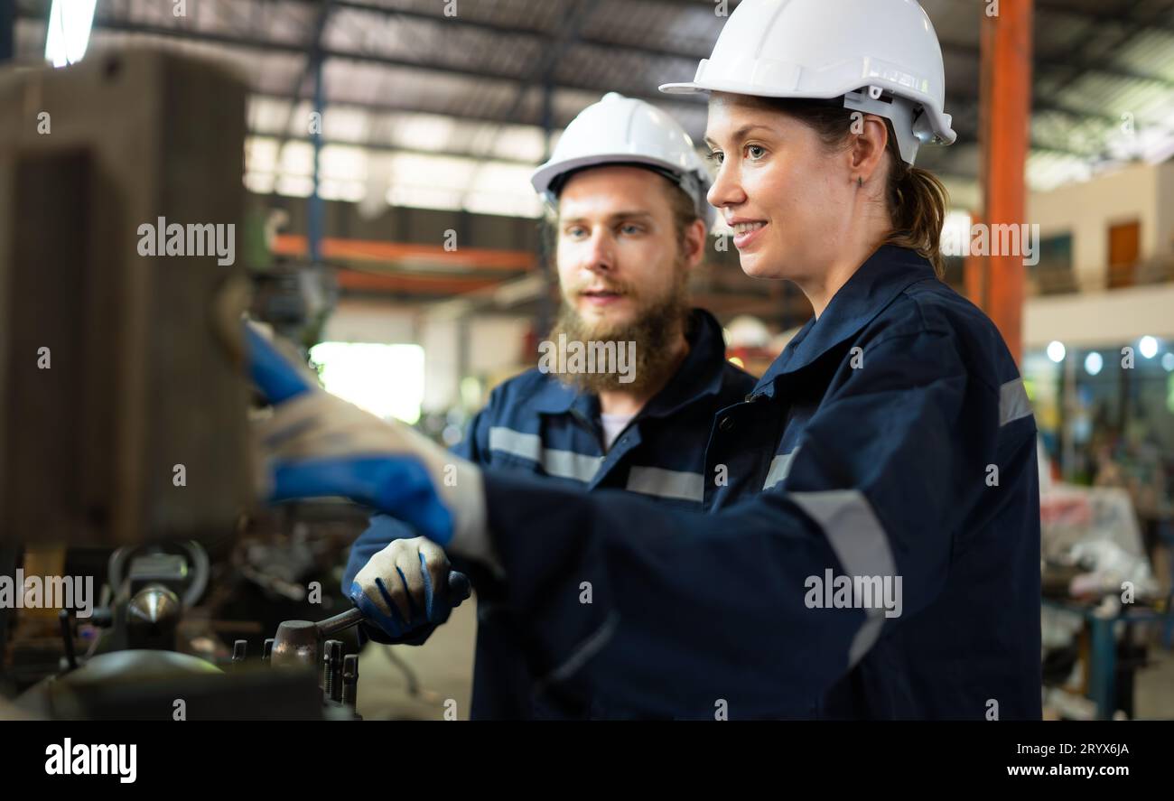 Both of mechanical engineers are checking the working condition of an ...