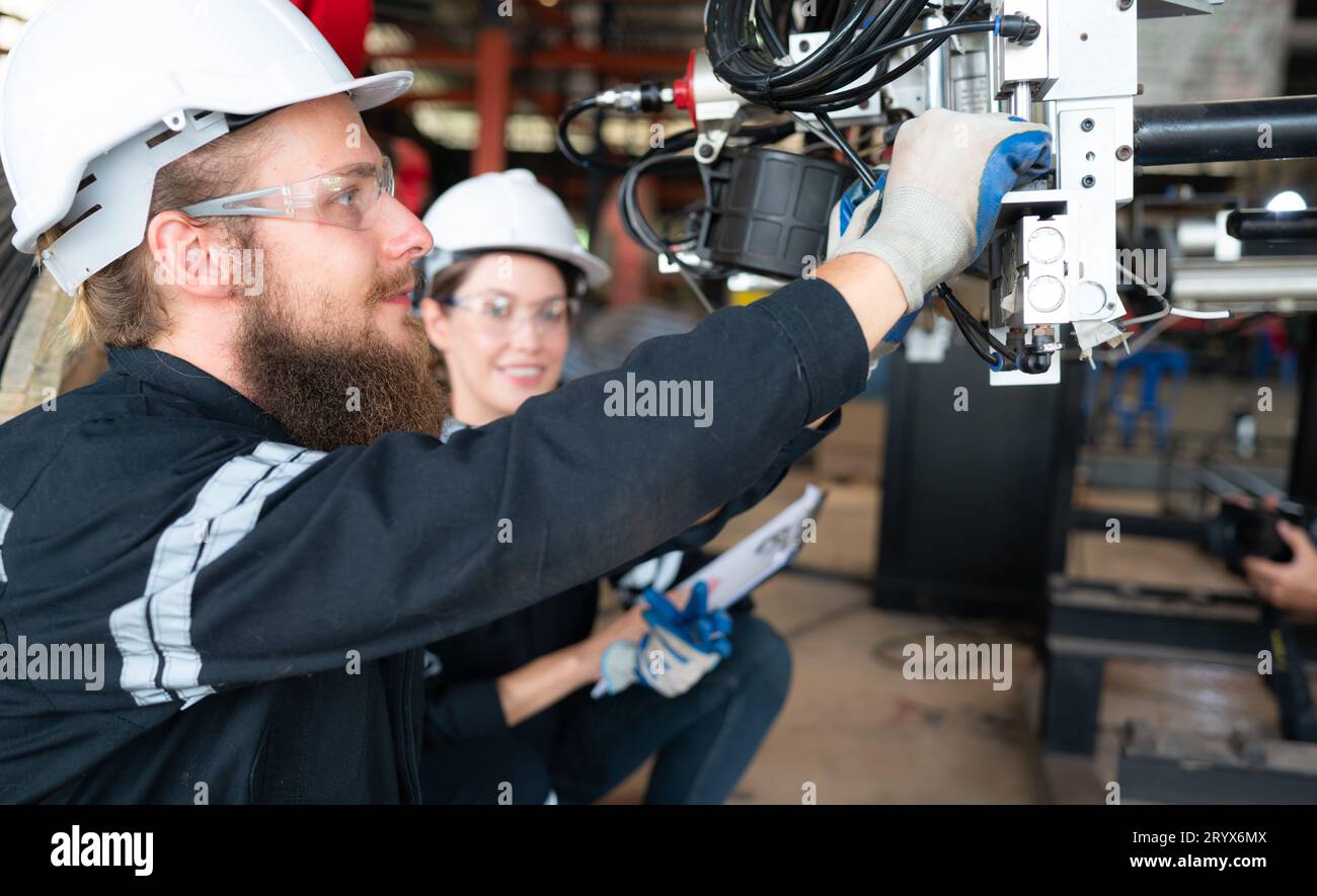Electrical engineer with the mission of installing a robot arm ...