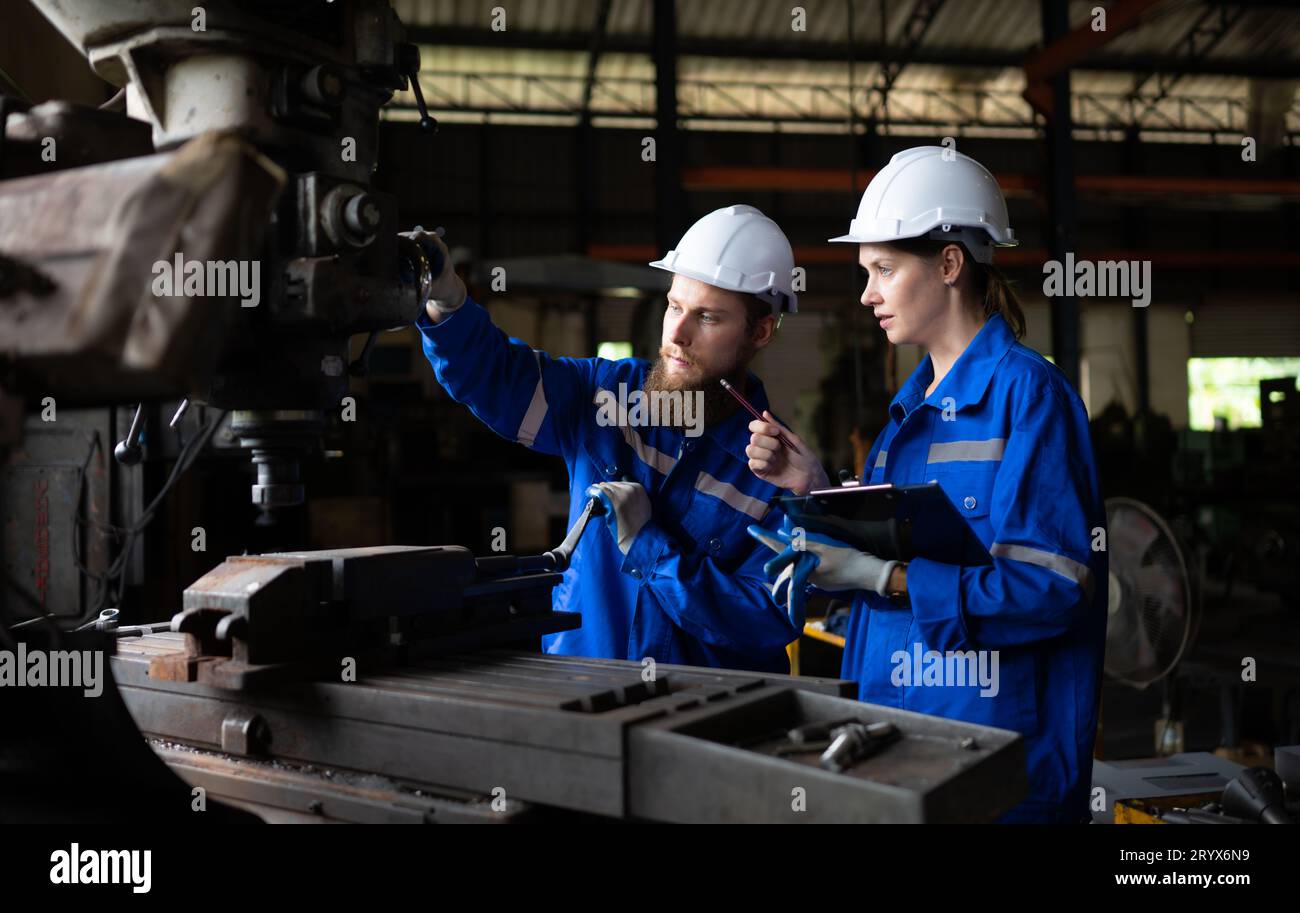 Female mechanic operating drilling machine hi-res stock photography and ...