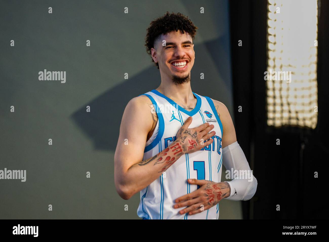 Charlotte Hornets guard LaMelo Ball laughs at the NBA basketball's team ...