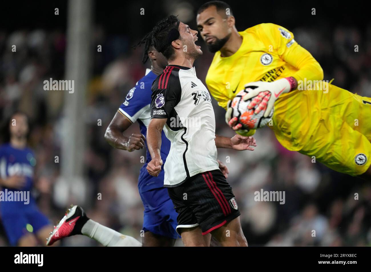 Chelsea's goalkeeper Robert Sanchez makes a save against Fulham's Raul ...