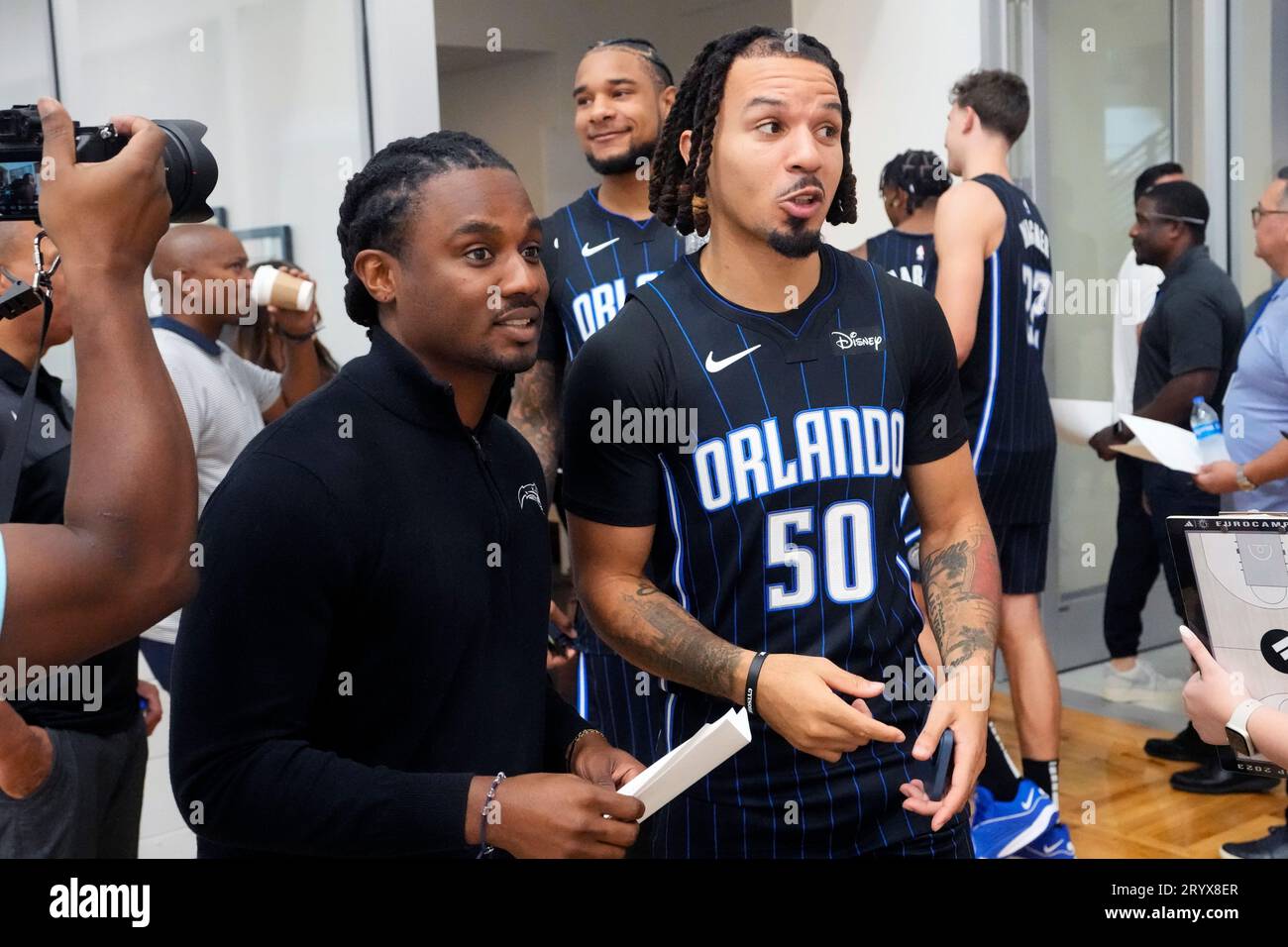 Orlando Magic guard Cole Anthony (50) arrives with teammates at the NBA ...