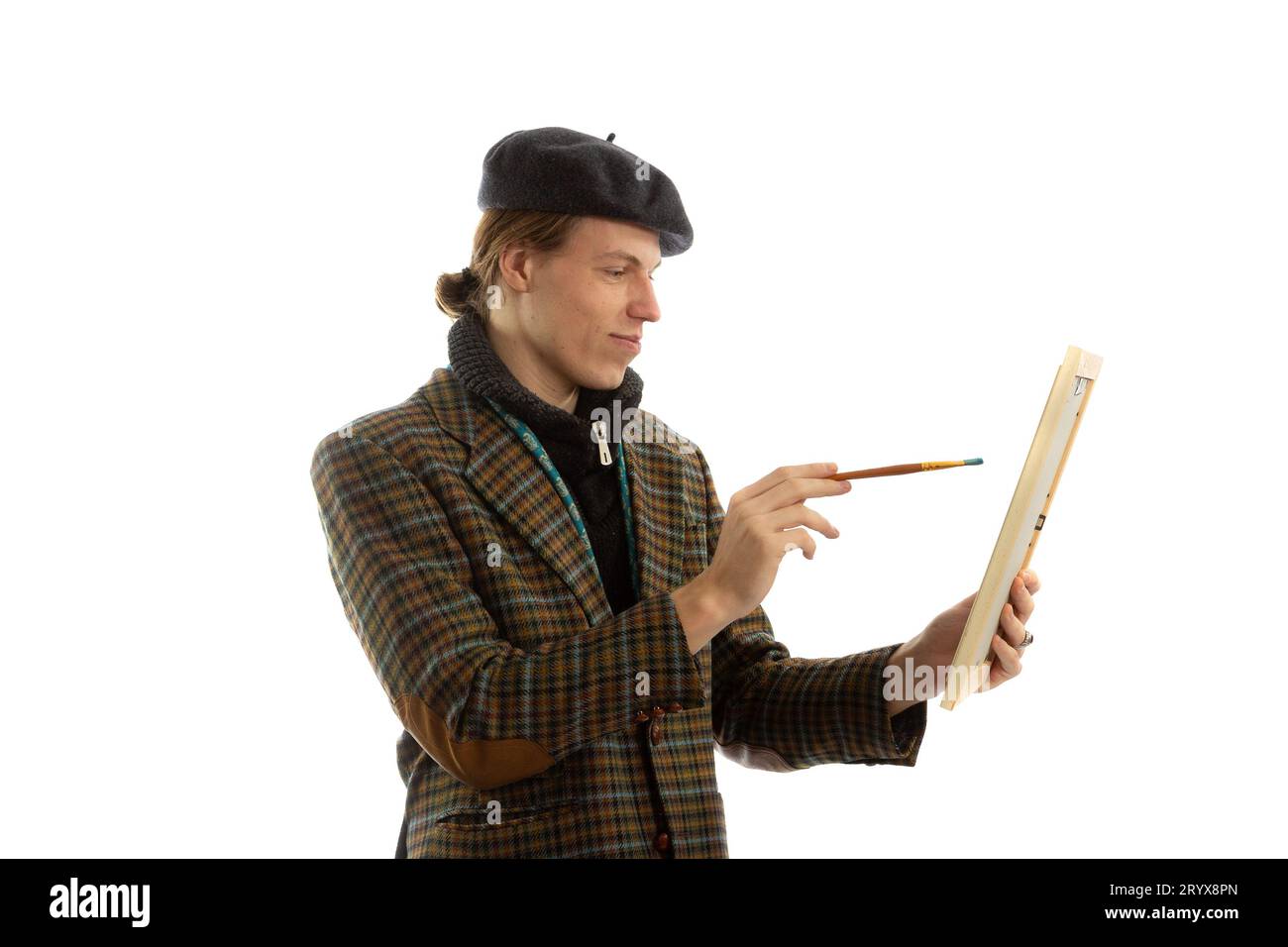 Young smiling artist with a beret on his head Stock Photo - Alamy