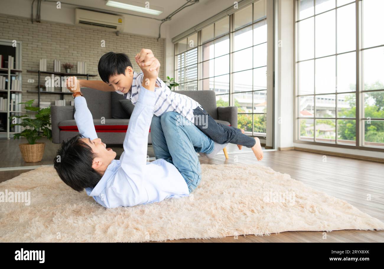 A boy wants to fly with his father by using his legs to help him fly ...