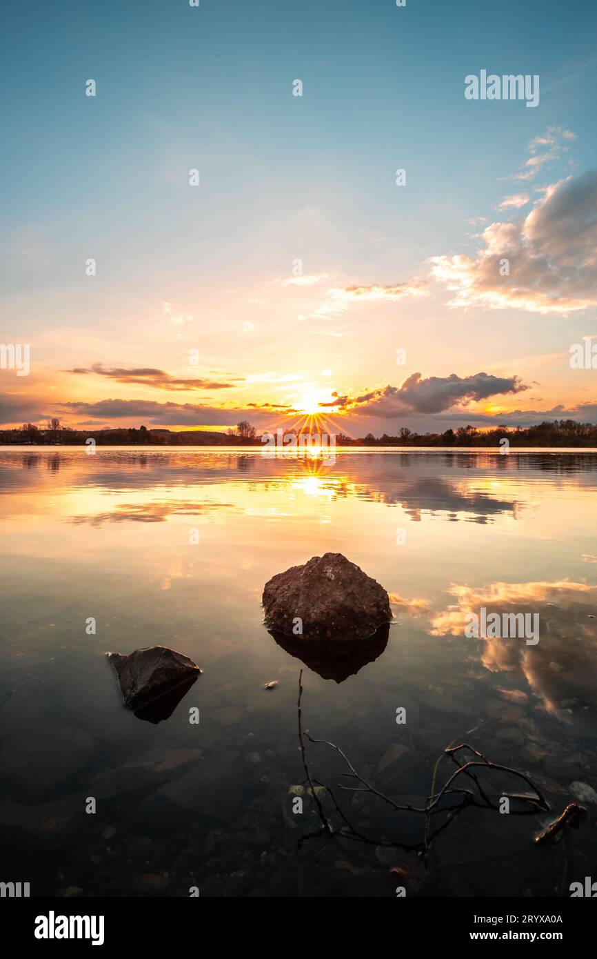 Majestic Evening Glow: Sunset over a lake, showcasing the beauty of ...