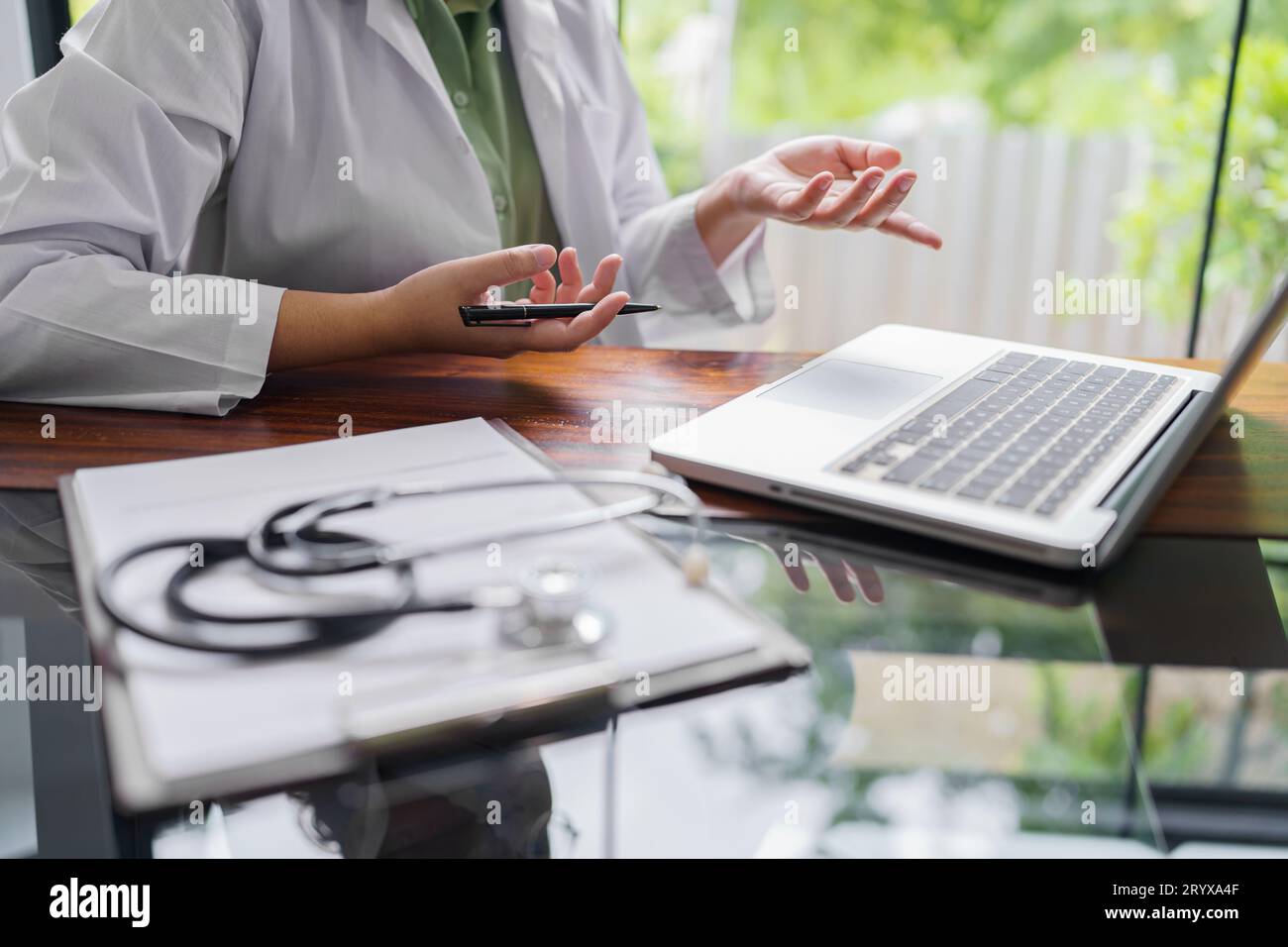 Doctor talking to online patient on laptop online consultation health ...