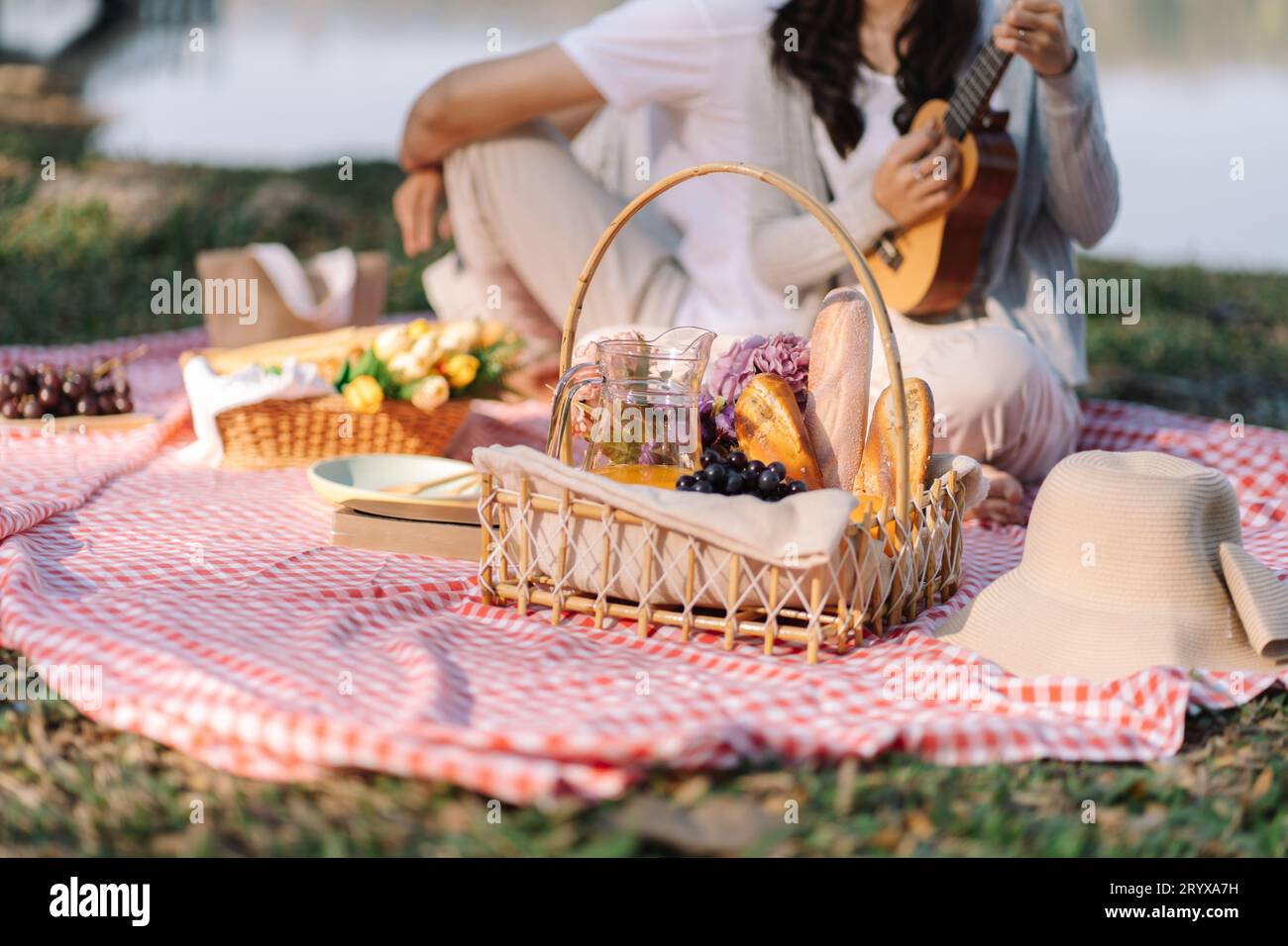 In love couple enjoying picnic time playing guitar in park outdoors Picnic. happy couple ...
