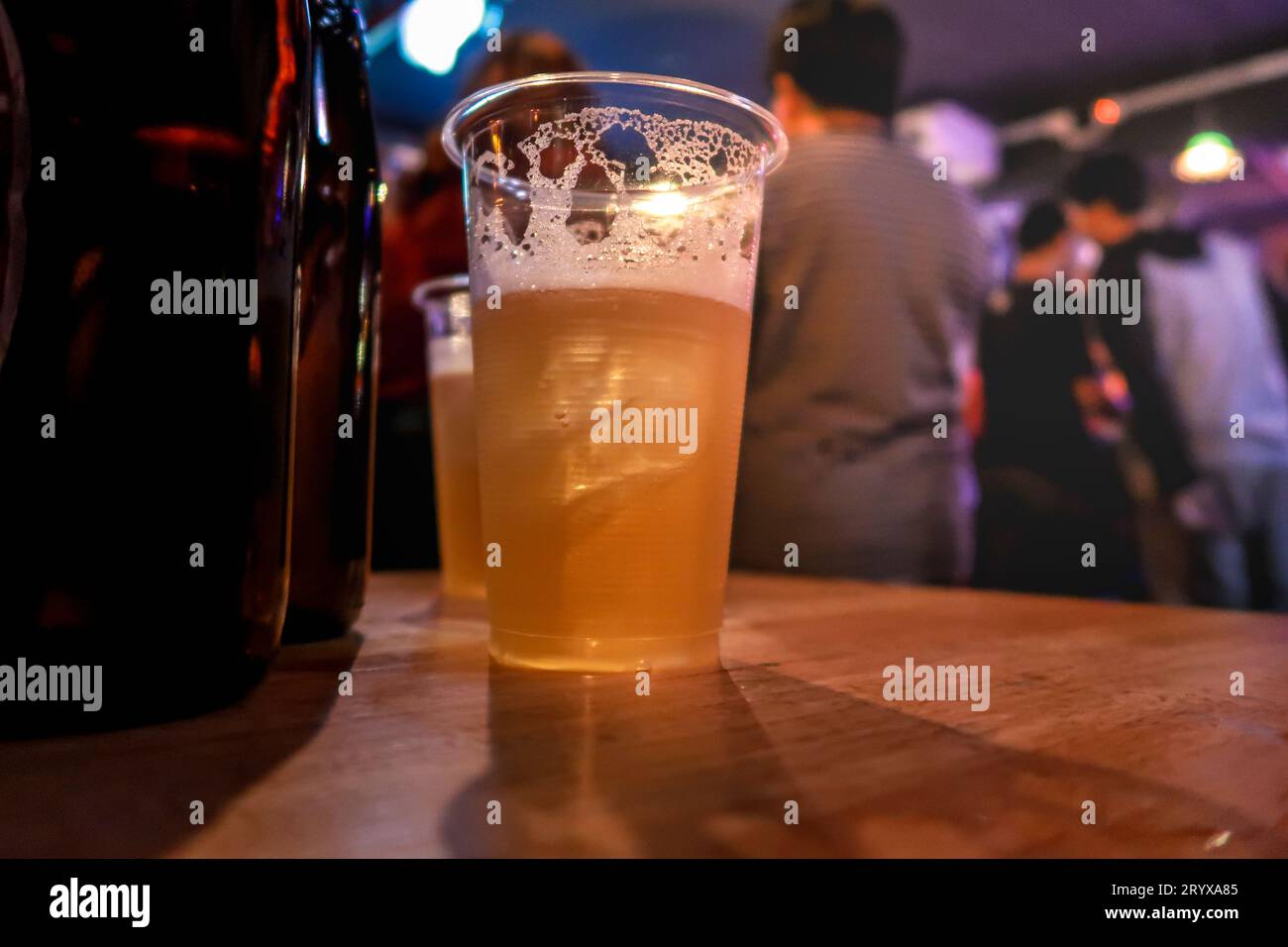Draft beer. Enjoying Evening Drinks at the pub party in a nightclub ...