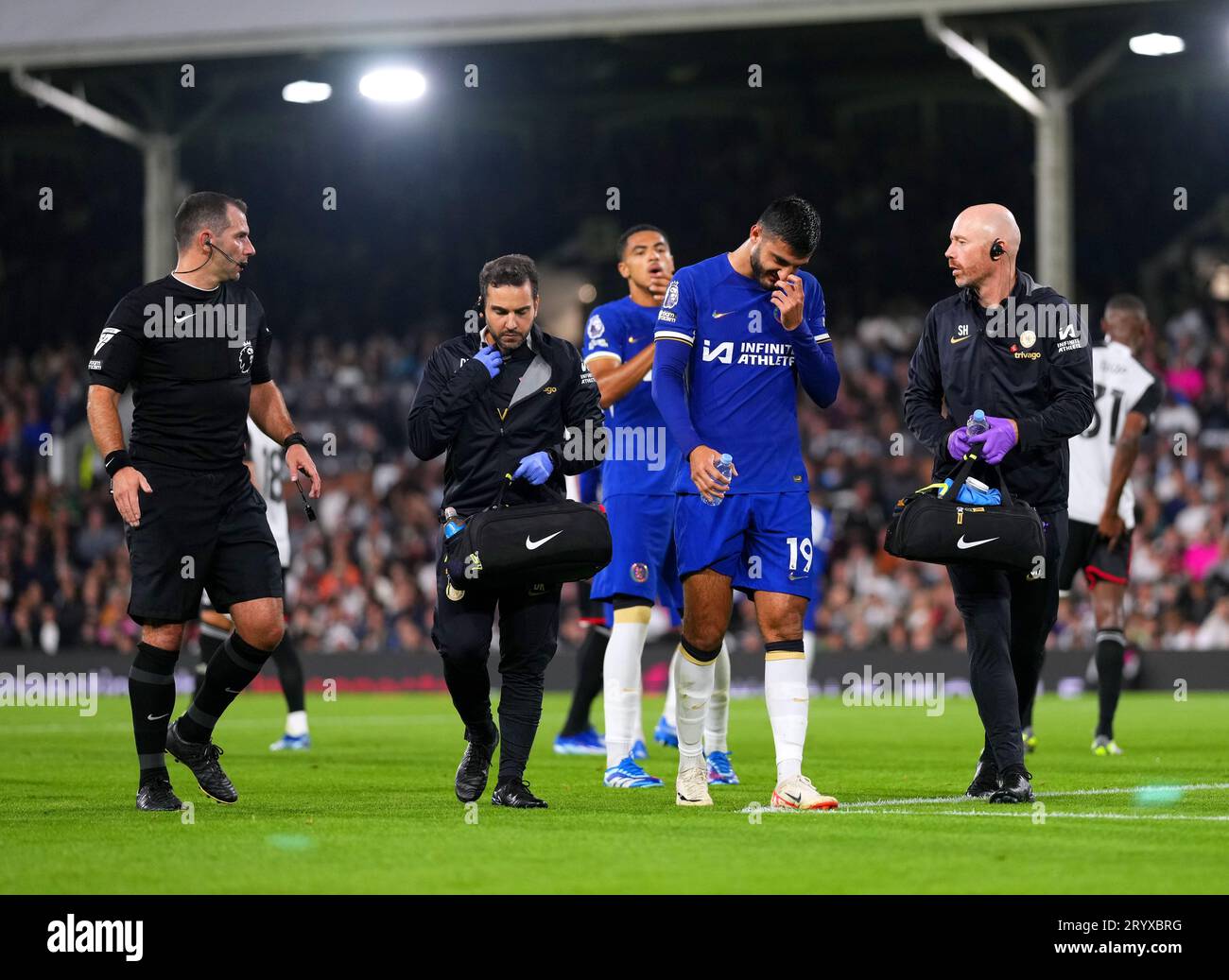 Chelsea's Armando Broja leaves the pitch after picking up an injury ...