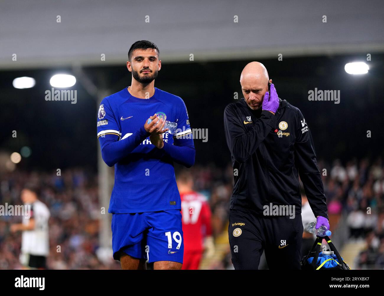 Chelsea's Armando Broja leaves the pitch after picking up an injury ...